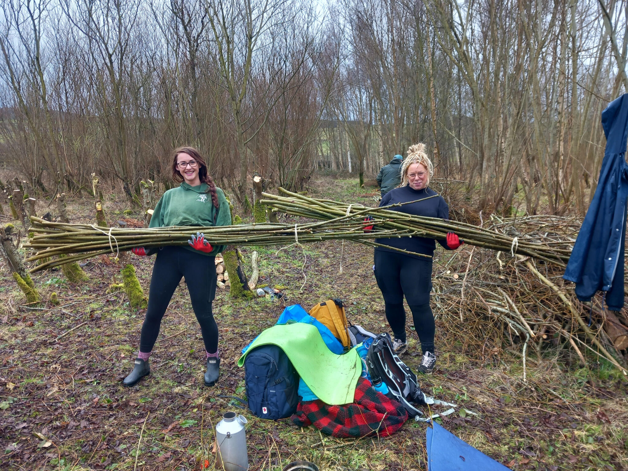 Happy volunteers at our willow coppice - Living Woods